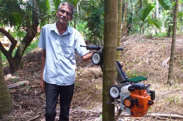 A bike which can ride on trees of Supaaree, Coconut or Areca Nuts, an ...